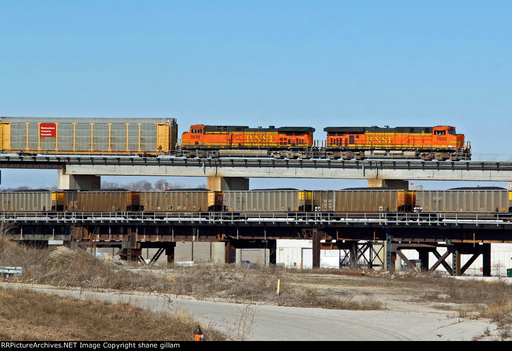 BNSF 7650 Takes a EB auto Past a EB coal load.